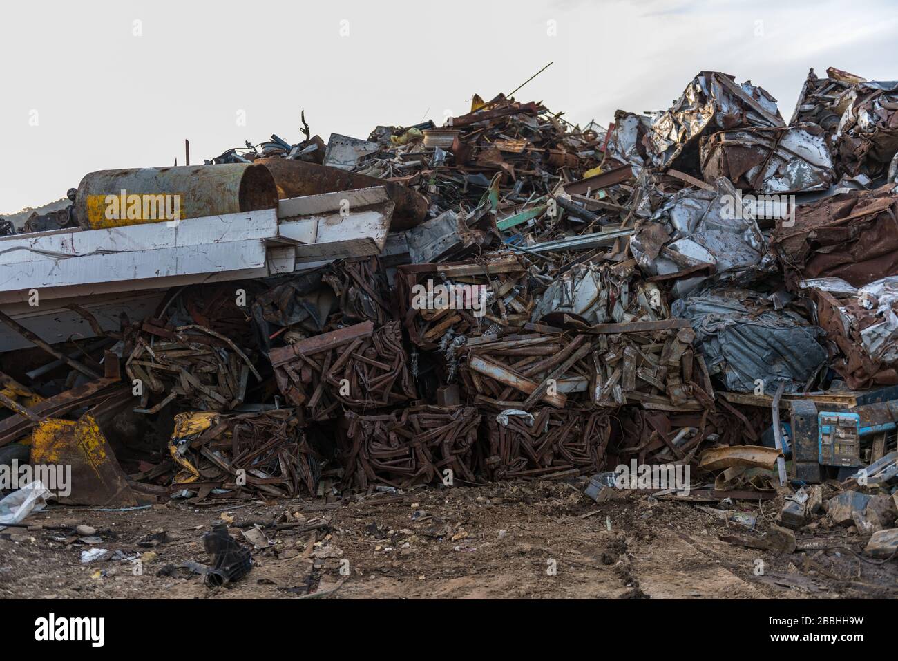 Stacks of cubes of metal pieces in a scrap yard Stock Photo - Alamy