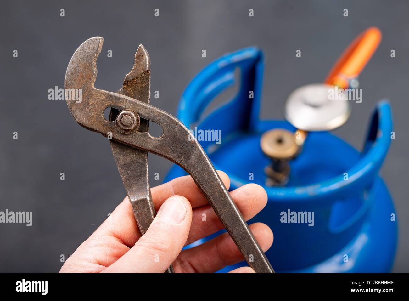 Gas cylinder, reducer and key. Gas installation accessories. Dark ...