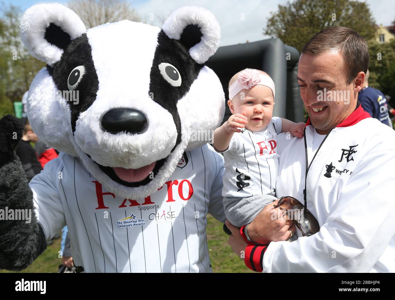 Layla Baker and Martin Baker with Fulham mascot Billy the Badger Stock ...