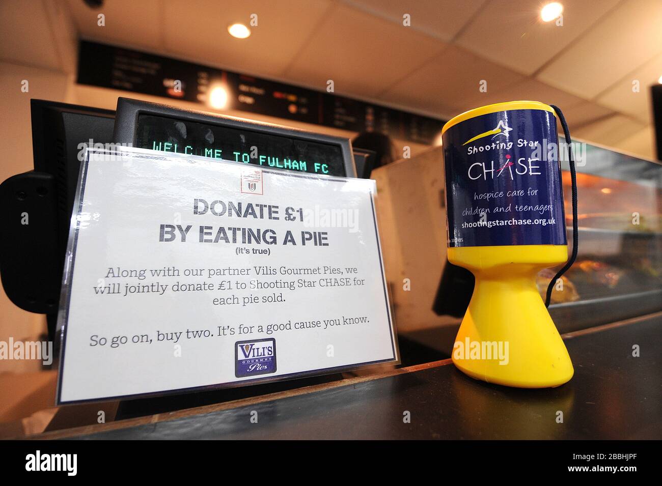 A shooting Star Chase charity collection pot at Craven Cottage Stock ...