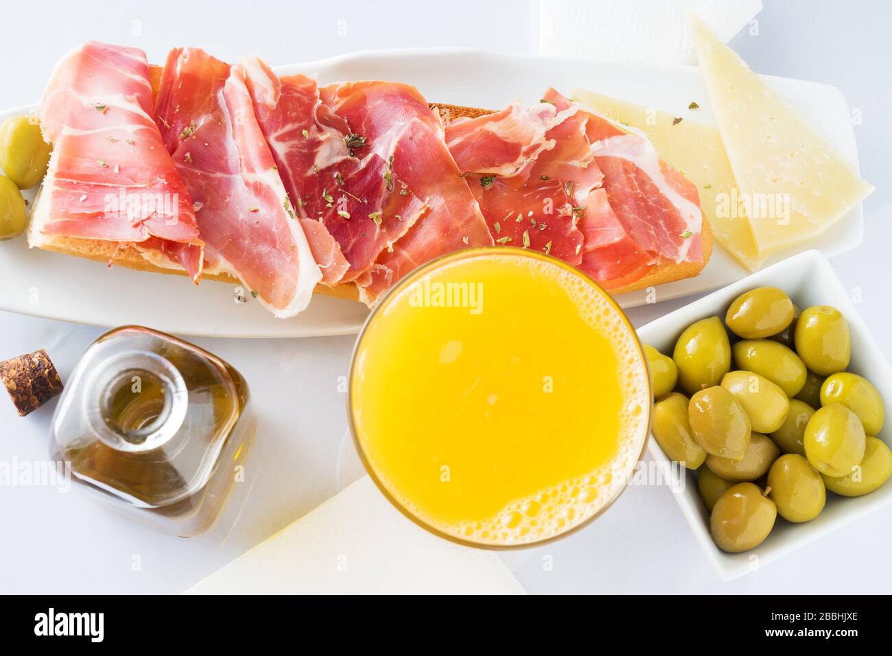 Delicious breakfast toast with hamon orange juice and olives Stock ...