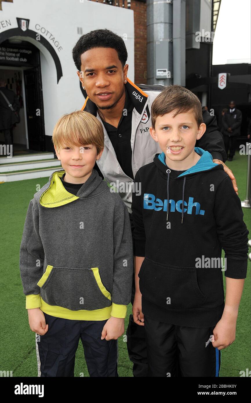 Fulham's Urby Emanuelson poses with the match day mascots before the ...