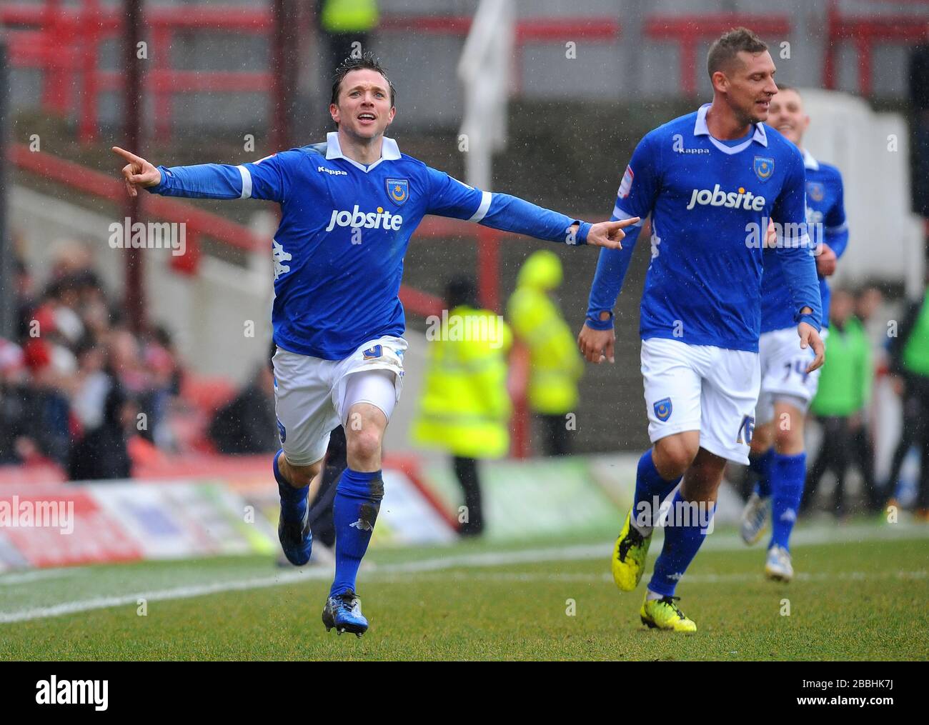 Portsmouth's David Connolley (left) celebrates socing his side's first ...