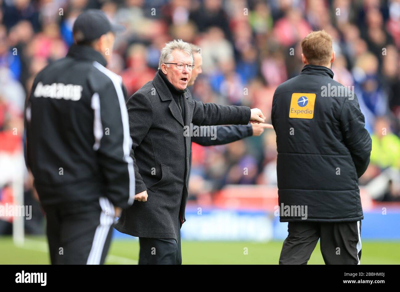 Manchester United's manager Sir Alex Ferguson argues with fourth ...