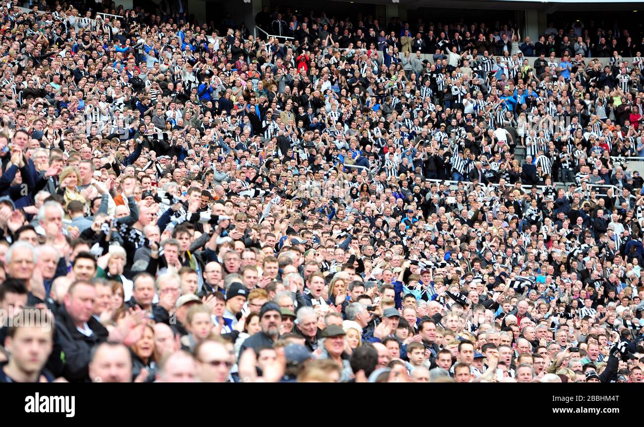 Newcastle United fans in the stand Stock Photo - Alamy