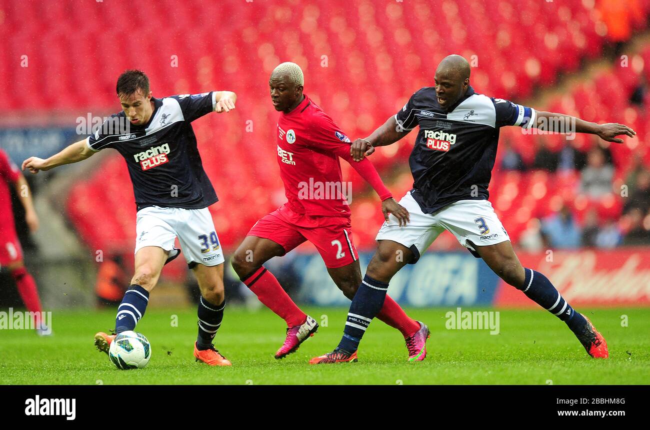 Wigan Athletic's Aruna Kone (centre) in action with Millwall's Sean St ...