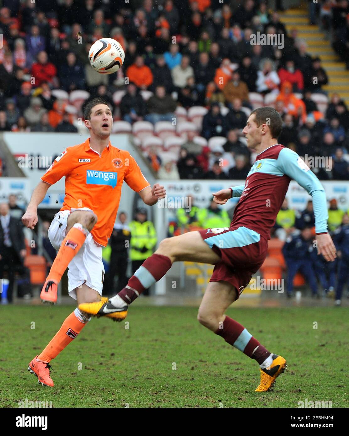Blackpool's Chris Basham (left) and Burnley's Chris McCann in action ...