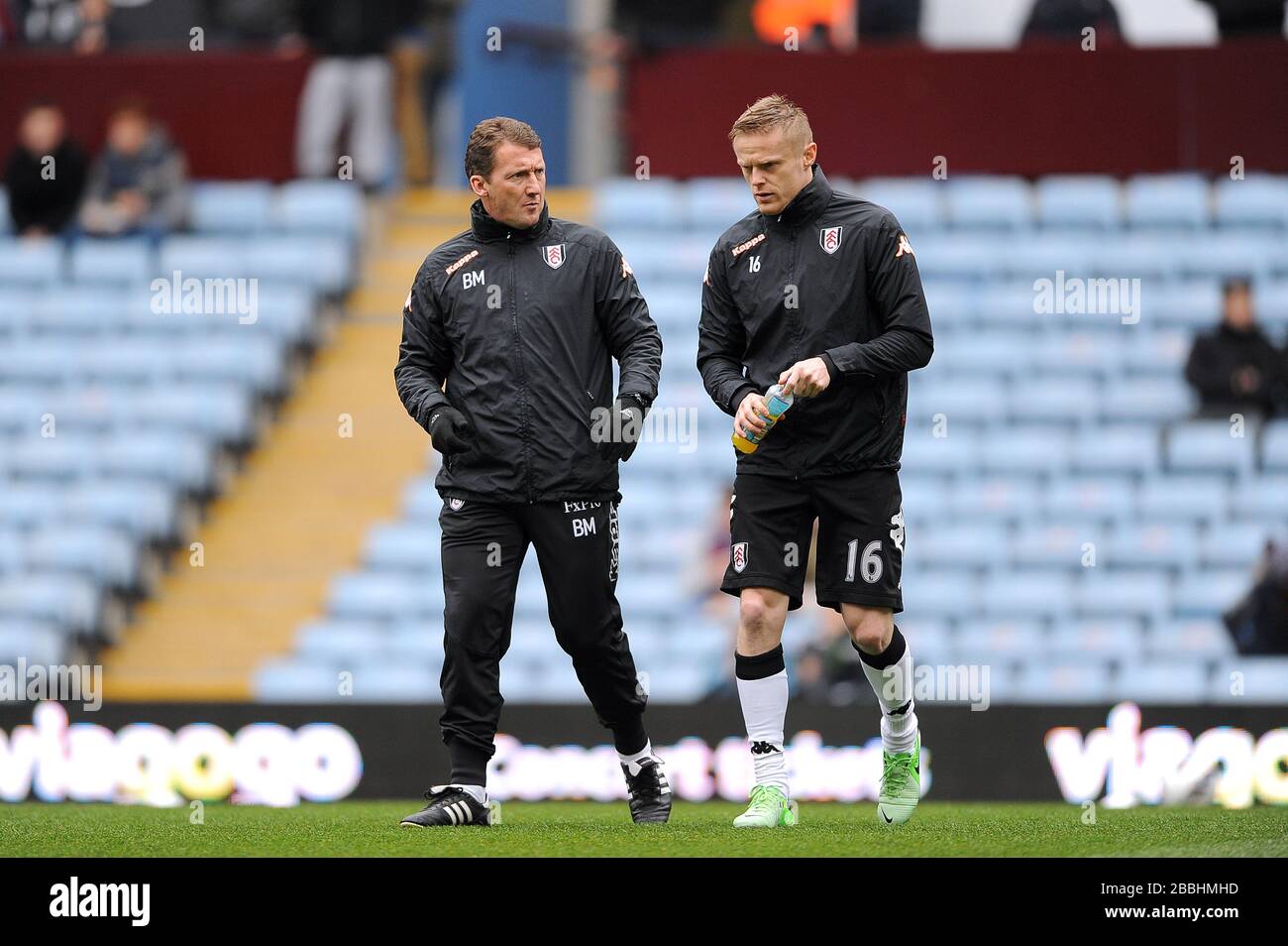 Fulham first team coach with Damien Duff (right) during the warm-up ...