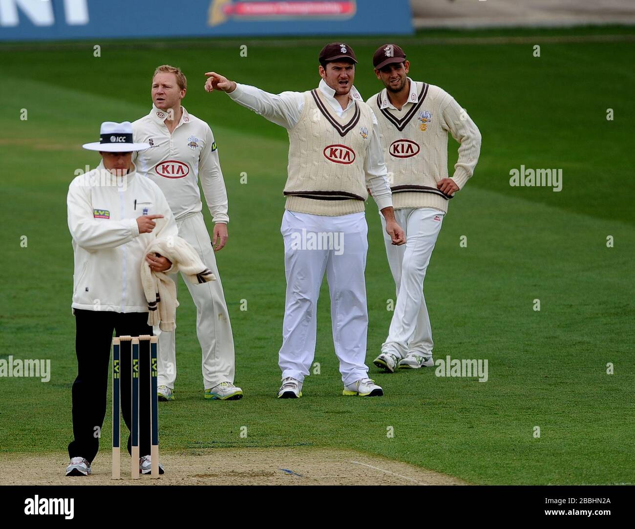 Surrey's Captain Graeme Smith (2nd right) makes field changes as Gareth ...