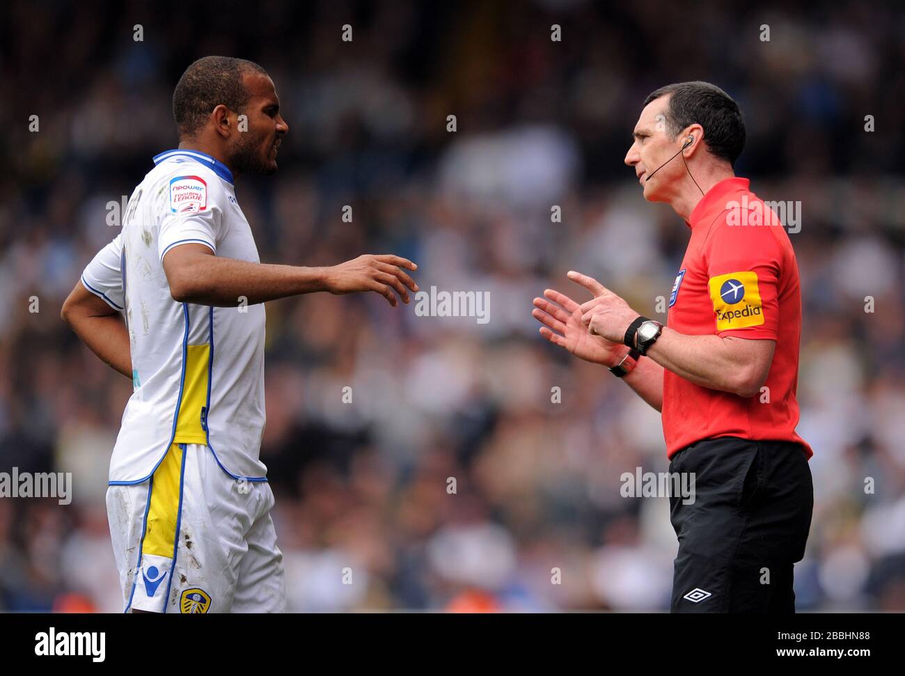 Referee Neil Swarbrick has words with Leeds United's Rodolph Austin ...