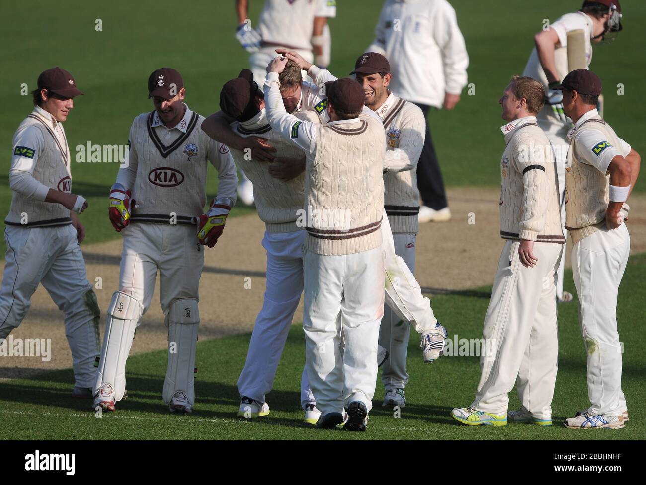 Surrey's Captain Graeme Smith lifts Stuart Meaker after the bowler took ...