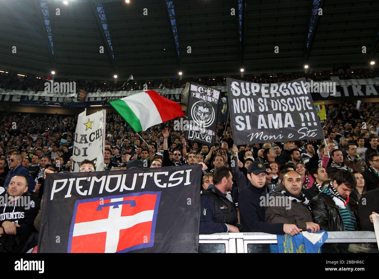 Juventus fans show their support in the stands Stock Photo - Alamy