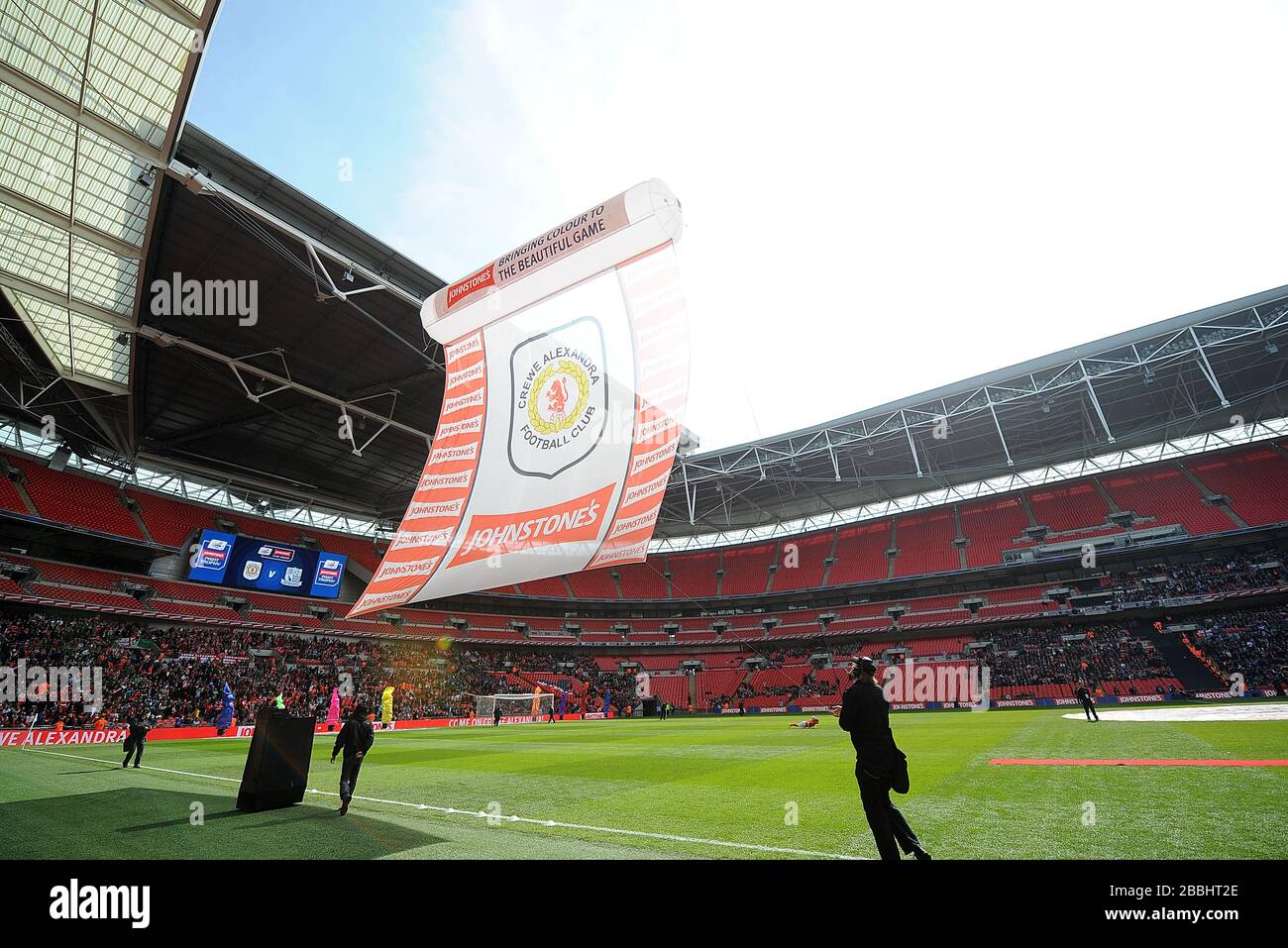 Two huge flags bearing the badges of both teams hang from the roof of ...