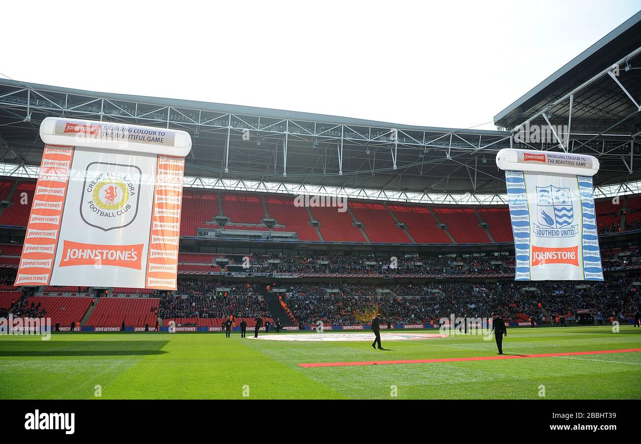 Two huge flags bearing the badges of both teams hang from the roof of ...