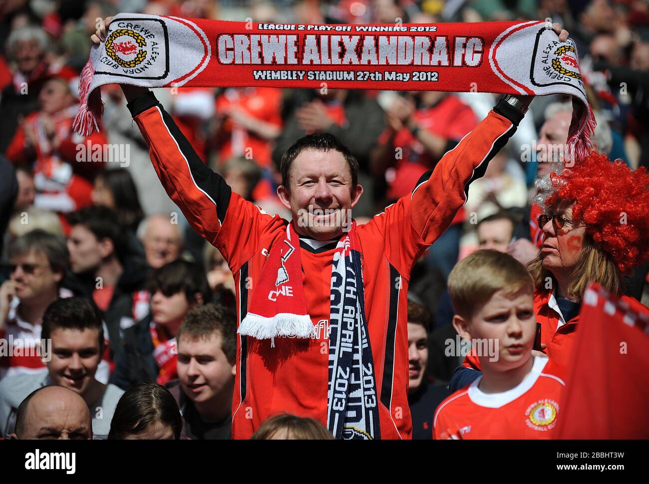 Crewe Alexandra fans cheer on their side in the stands before the kick ...
