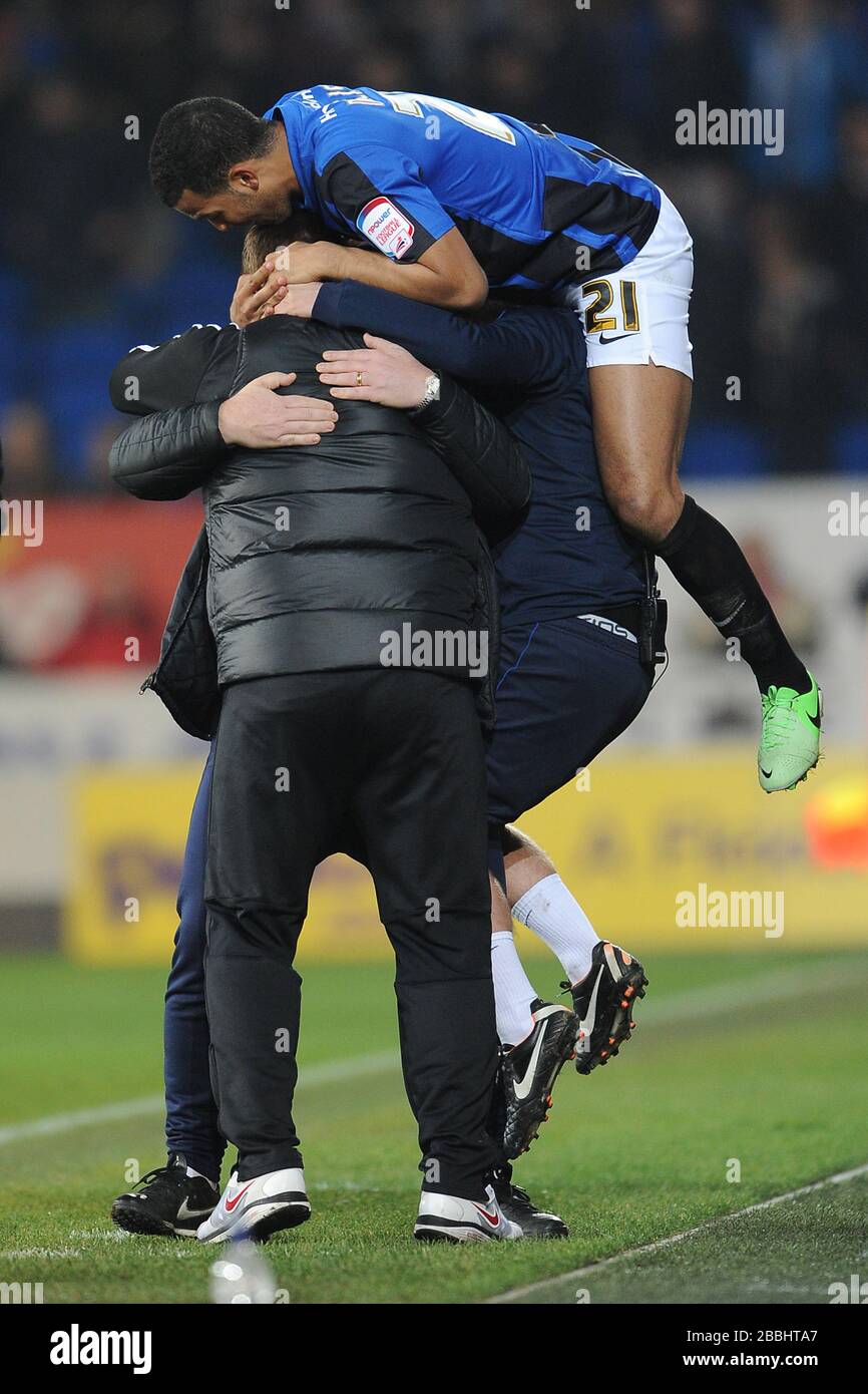 Barnsley manager David Flitcroft (hidden) celebrates an injury time ...