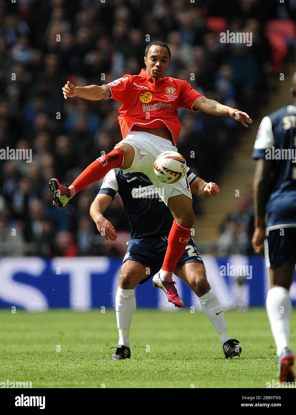 Crewe Alexandra's Byron Moore leaps to control the ball in mid air ...