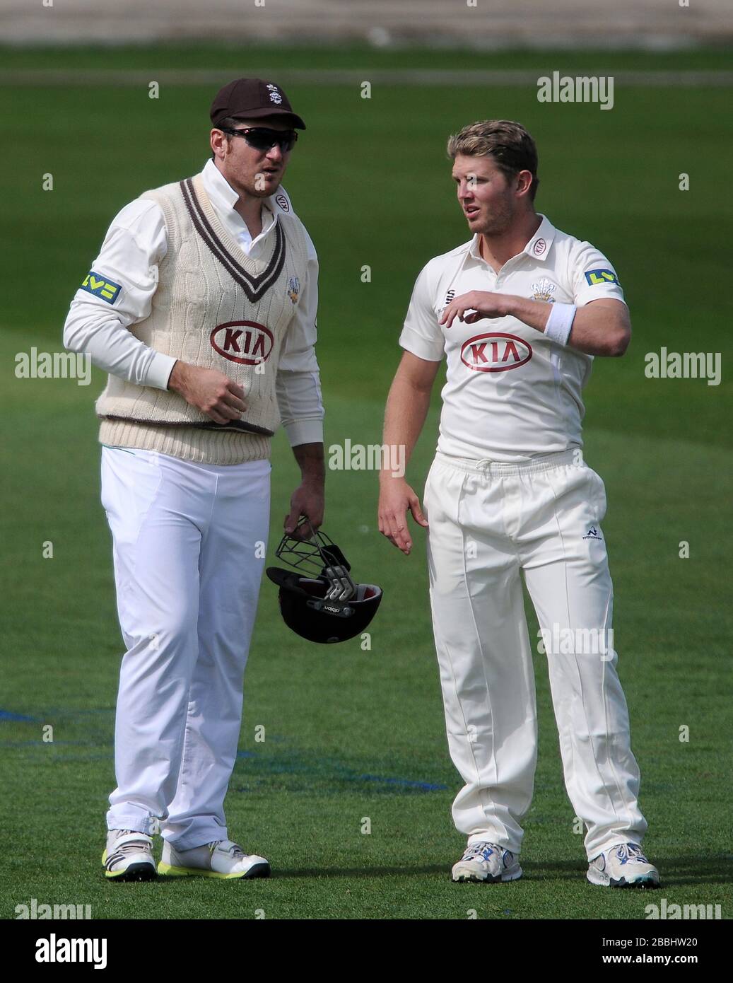 Surrey captain Graeme Smith (left) speaks with Stuart Meaker Stock ...