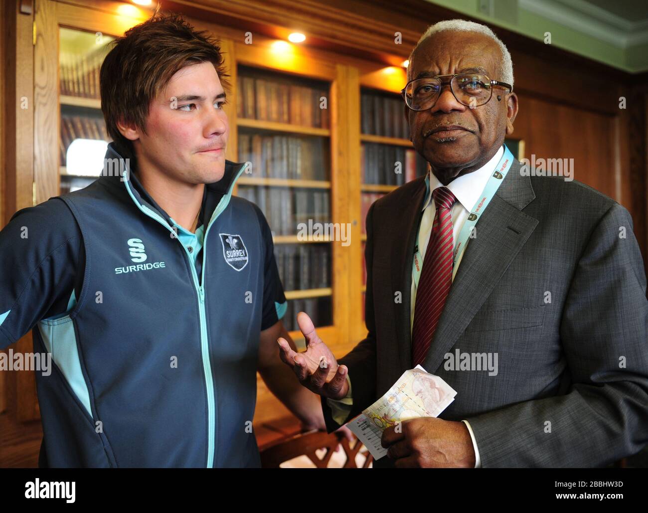 Surrey's Rory Burns and Sir Trevor MacDonald Stock Photo - Alamy