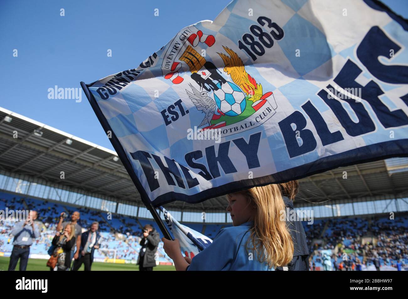 A Coventry City fan waves a flag Stock Photo - Alamy