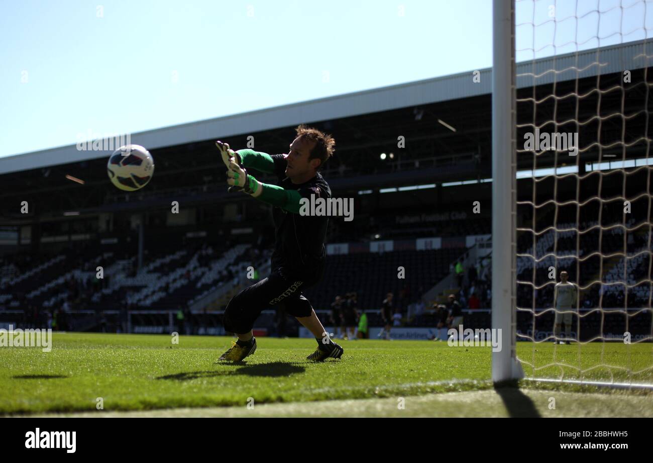 Fulham goalkeeper Mark Schwarzer is put through his paces during the ...