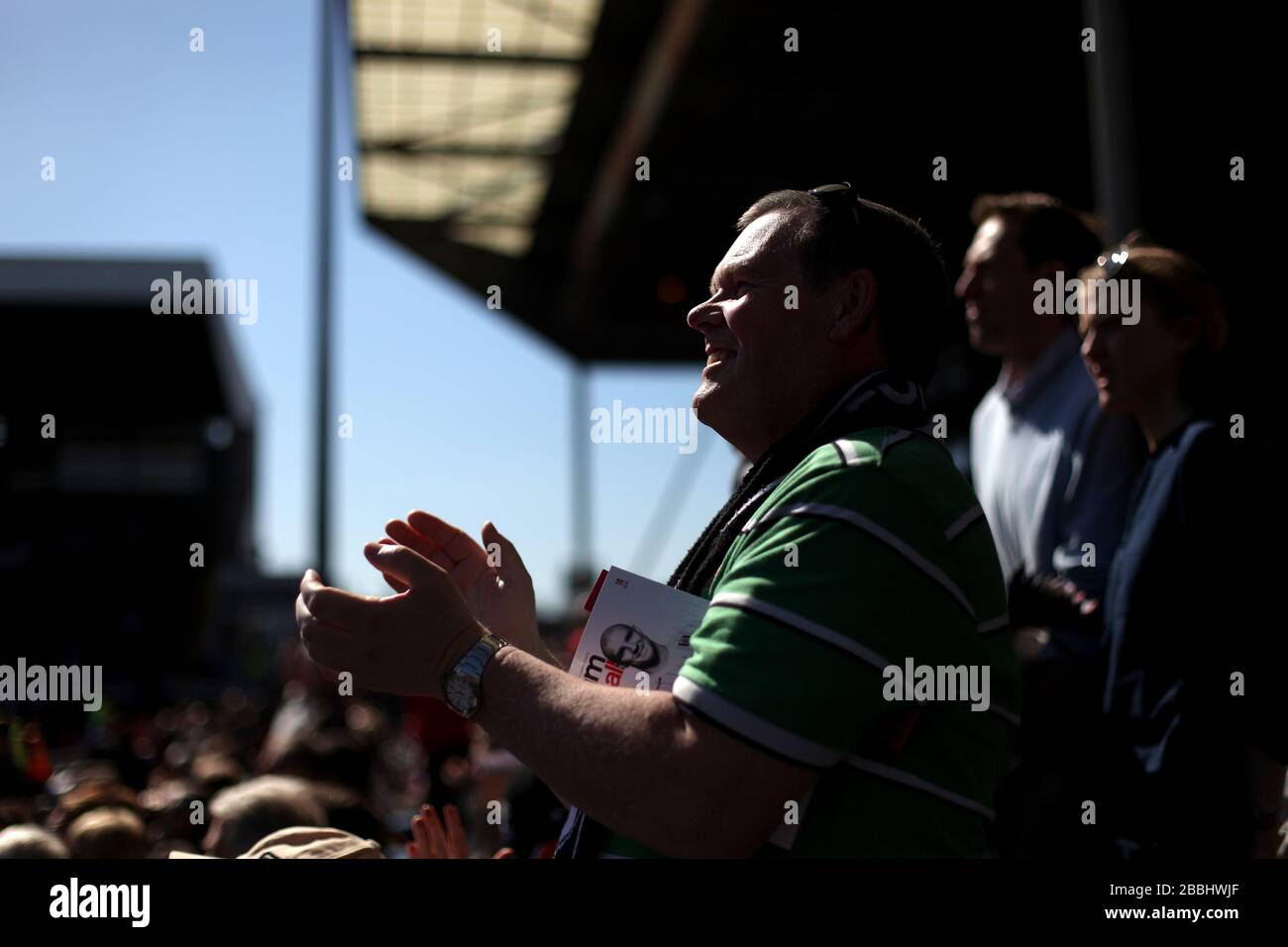 Fulham fans in the stands Stock Photo - Alamy