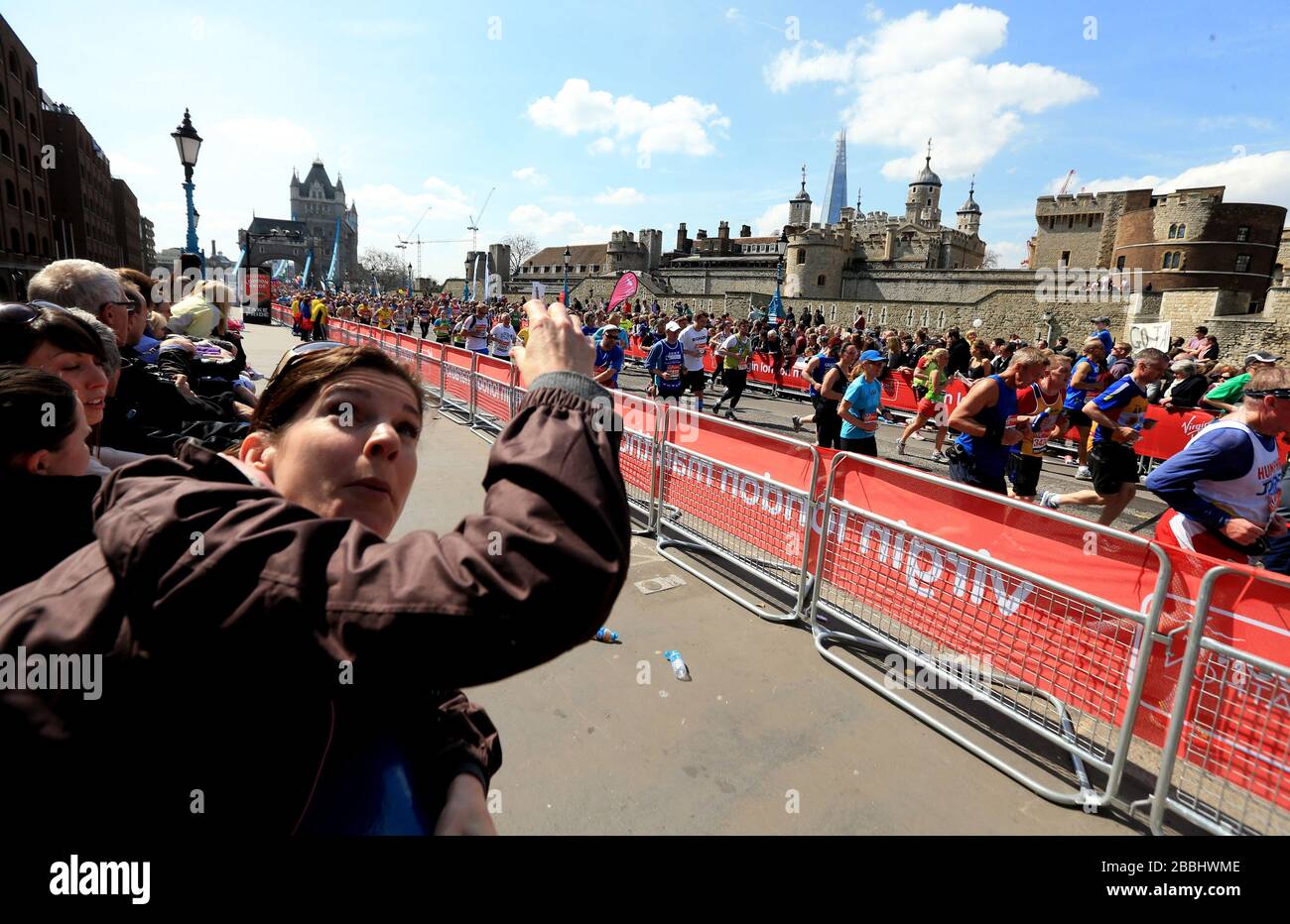 Supporters line the streets as the London Marathon runners compete ...