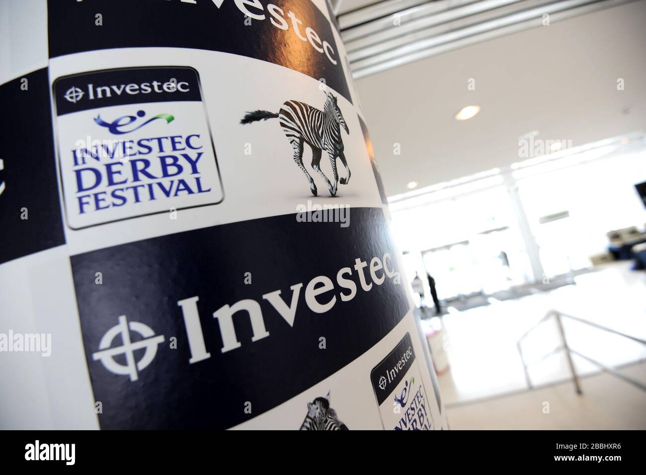 A general view of Investec branding around Epsom Downs Racecourse Stock ...