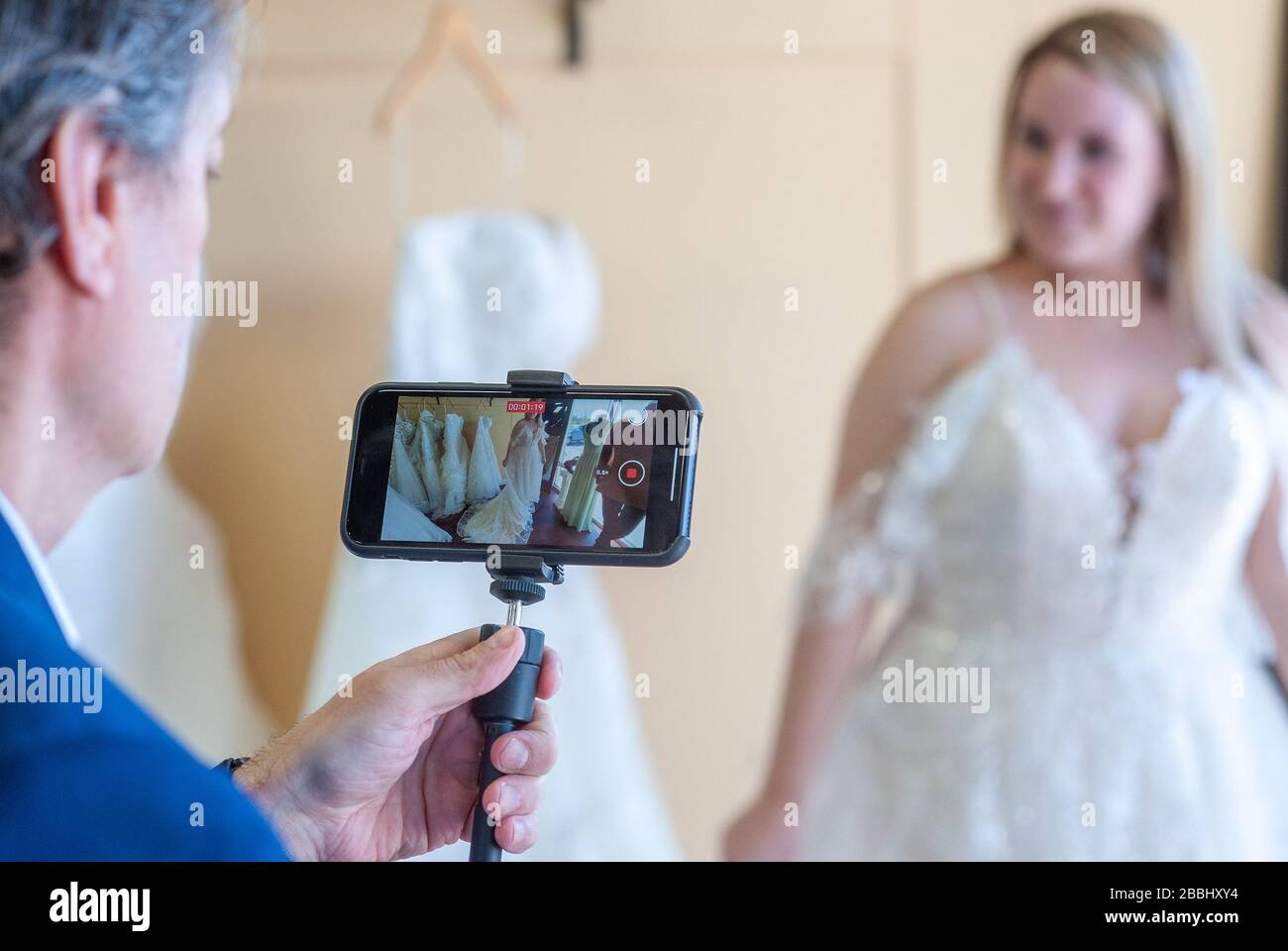 Franco Salerno (left) and Daria Capaldi videotape a dress for an online ...