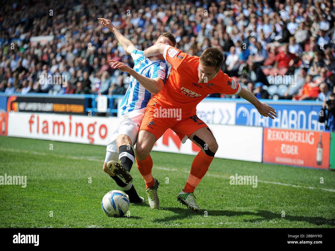 Millwall's James Henry shields the ball from Huddersfield Town's Calum ...