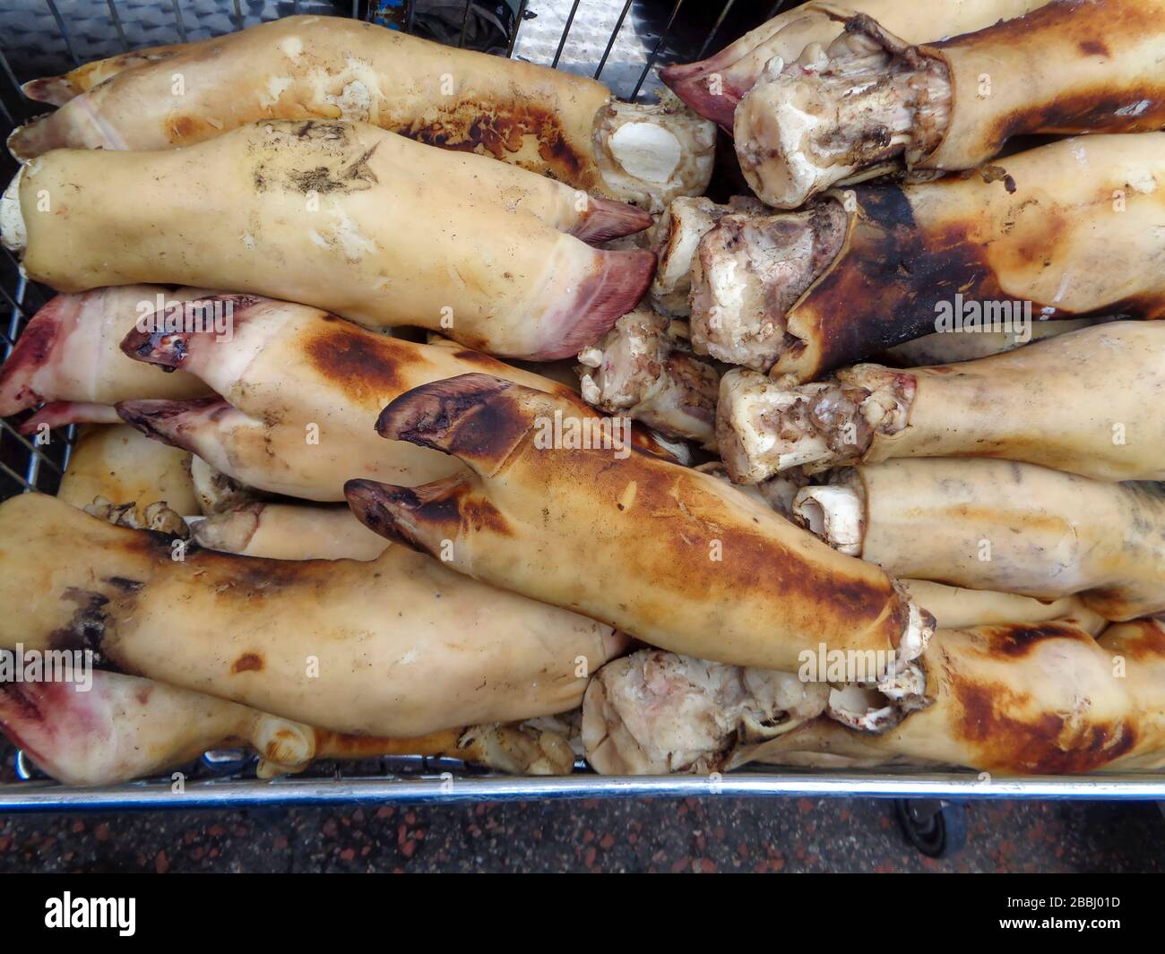 Pig's trotters piled up for sale food ingredient still-life Stock Photo ...