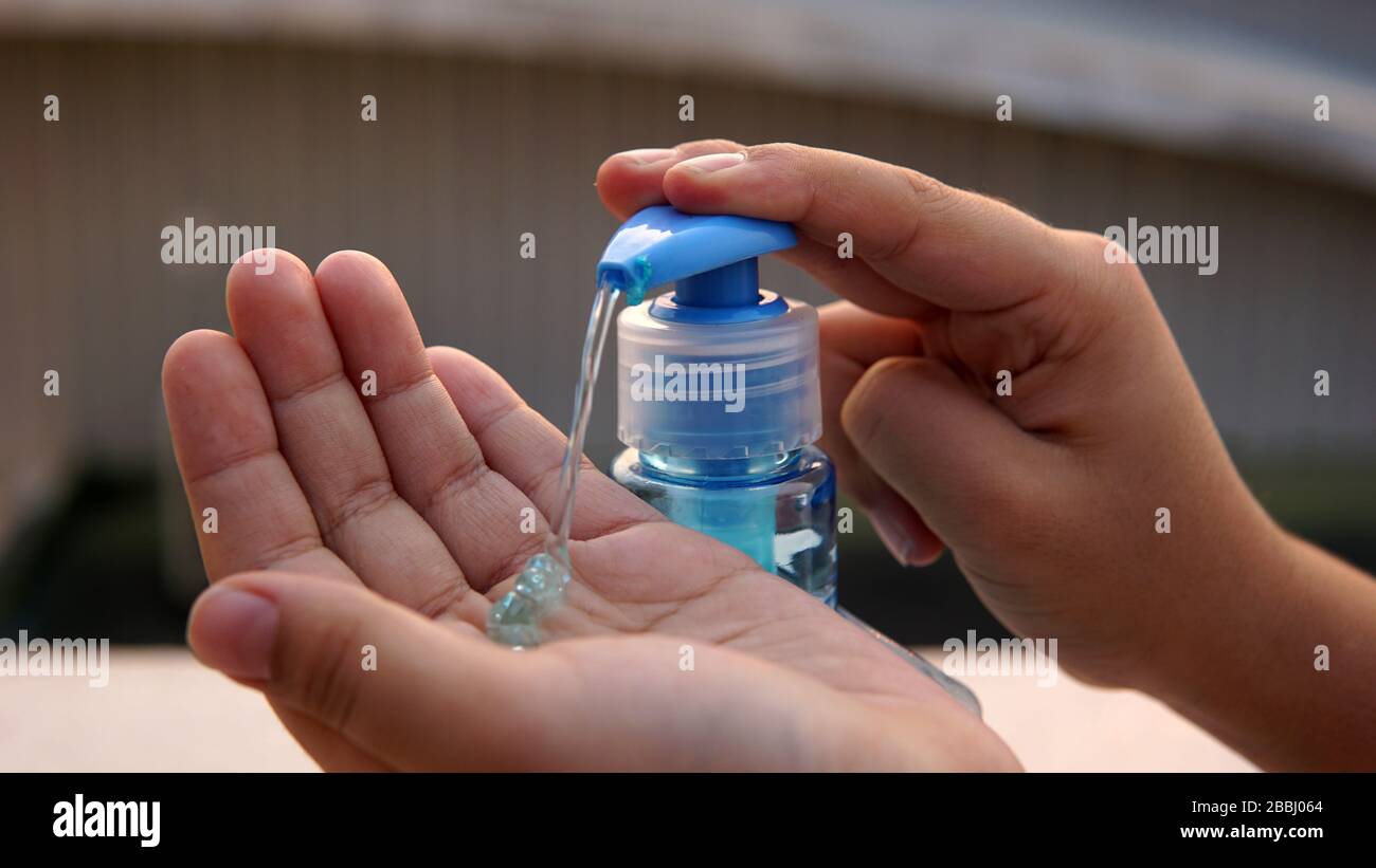Children washing hands with alcohol based gel to protect from corona ...