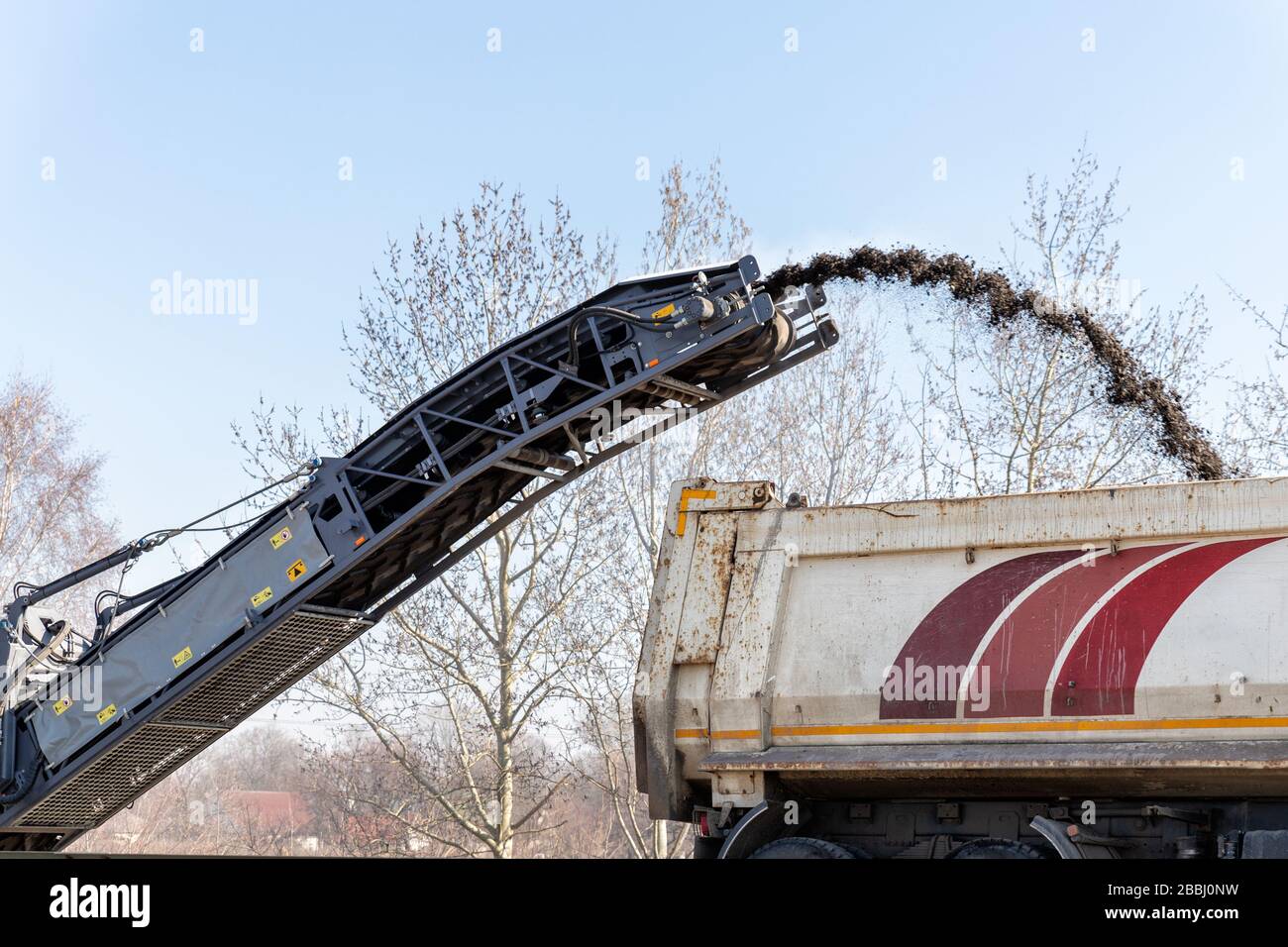 Asphalt milling and grinding machine at road repair and construction ...