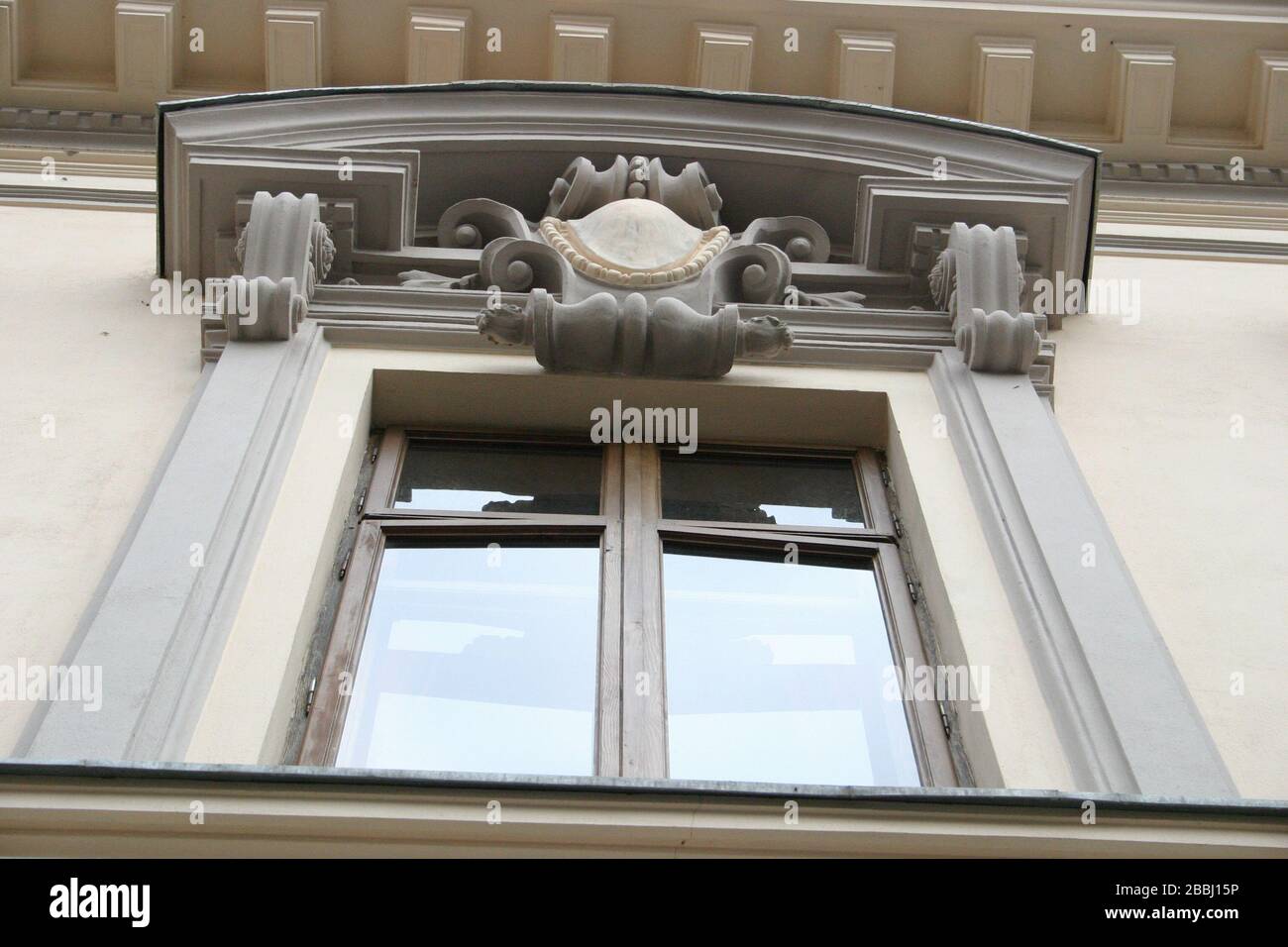 Elaborate architectural features around windows on 19th century old ...