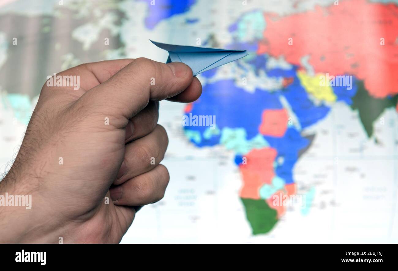 paper airplane on a background map of the world. Vacation destinations ...