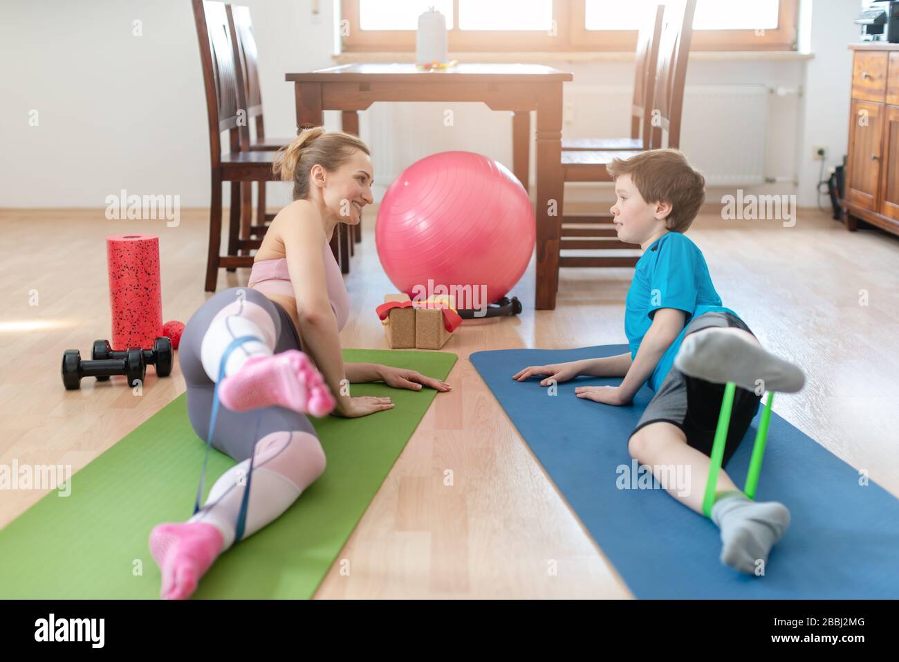 Family doing sport exercises at home during Covid-19 lockdown Stock ...