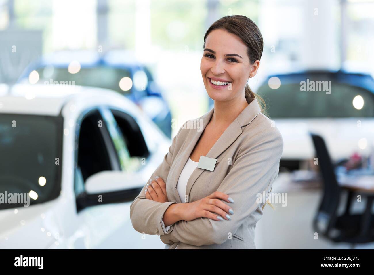 Young woman in the car showroom Stock Photo - Alamy
