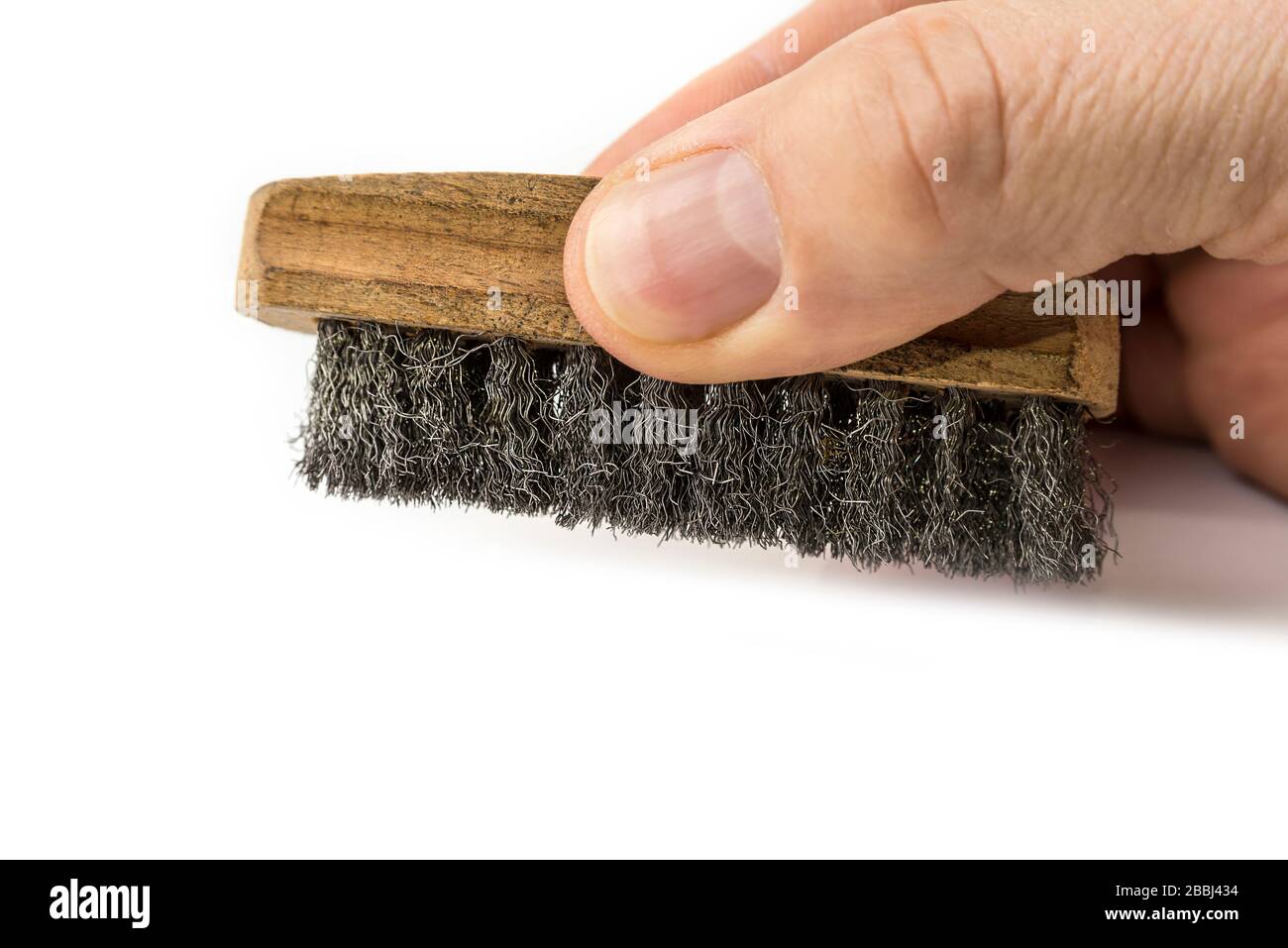 Used hand steel brush on a white background Stock Photo - Alamy