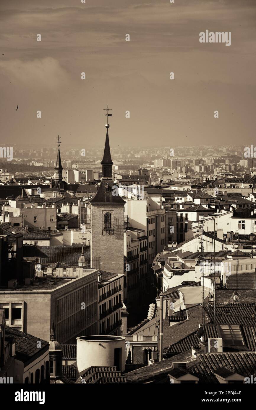 Madrid skyline rooftop view with buildings and church bell tower in ...