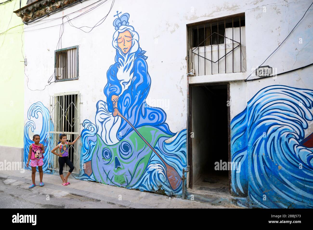 Two young girls and Wall Mural art, Havana Vieja, Cuba Stock Photo - Alamy