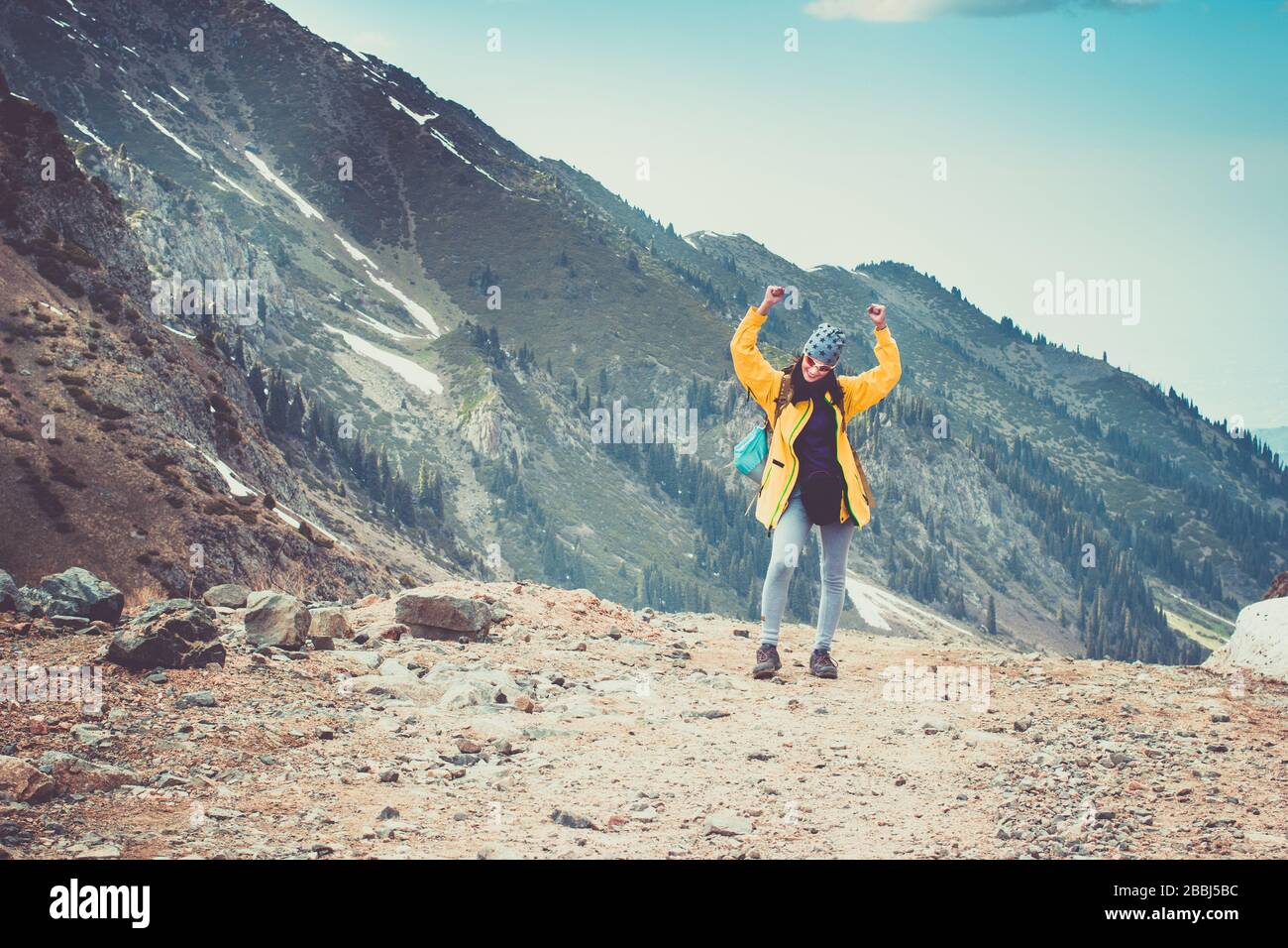Happy hiker winning reaching life goal, success, freedom and happiness ...
