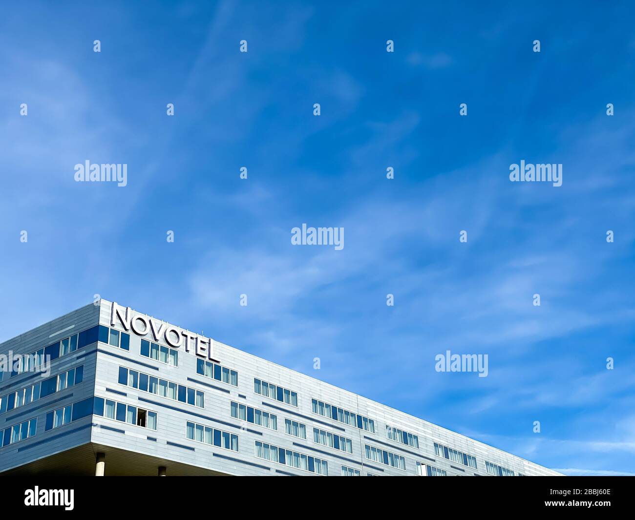 Novotel logo at hotel building located in Lyon, France on bright blue ...