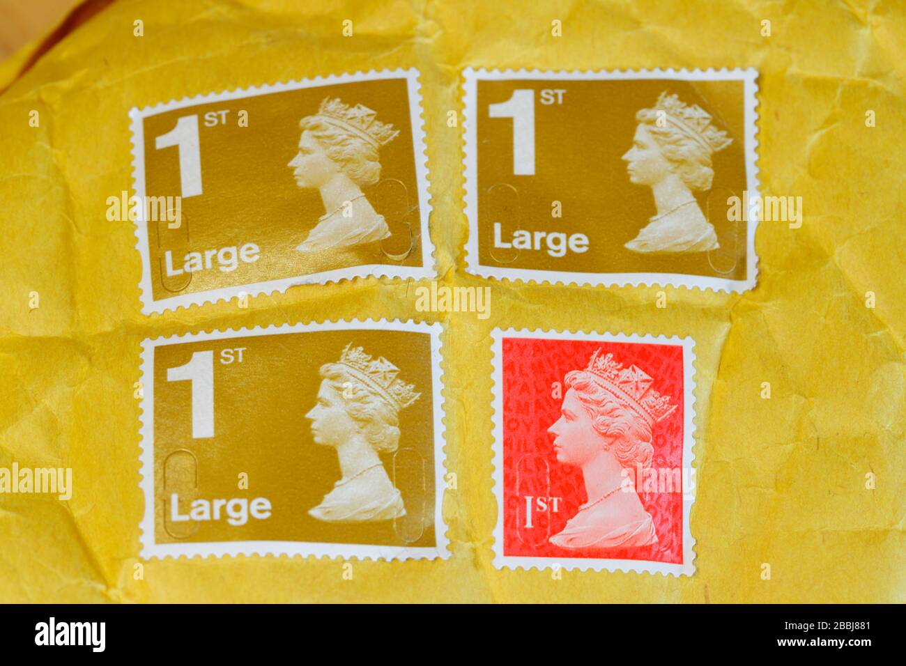 Stamps used to post a large parcel in the UK Stock Photo - Alamy