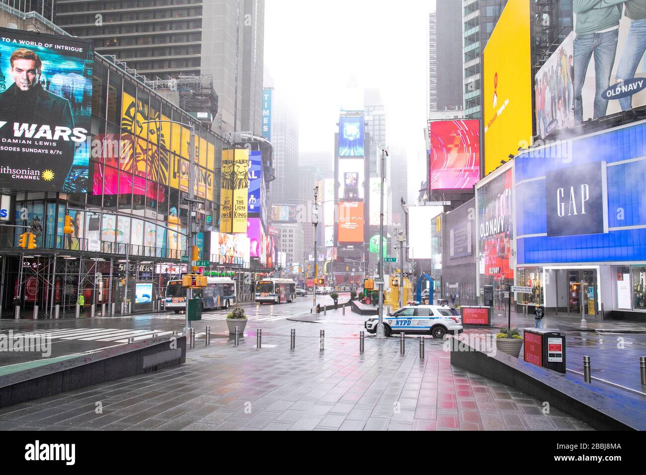 A quiet rainy day in Times Square during the coronavirus pandemic Stock ...