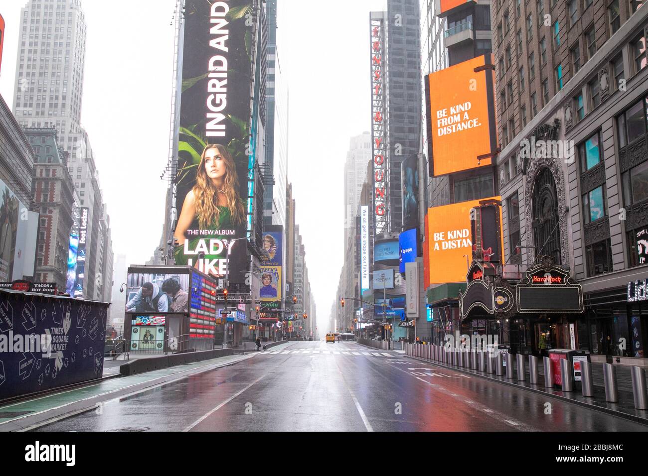 A quiet rainy day in Times Square during the coronavirus pandemic Stock ...