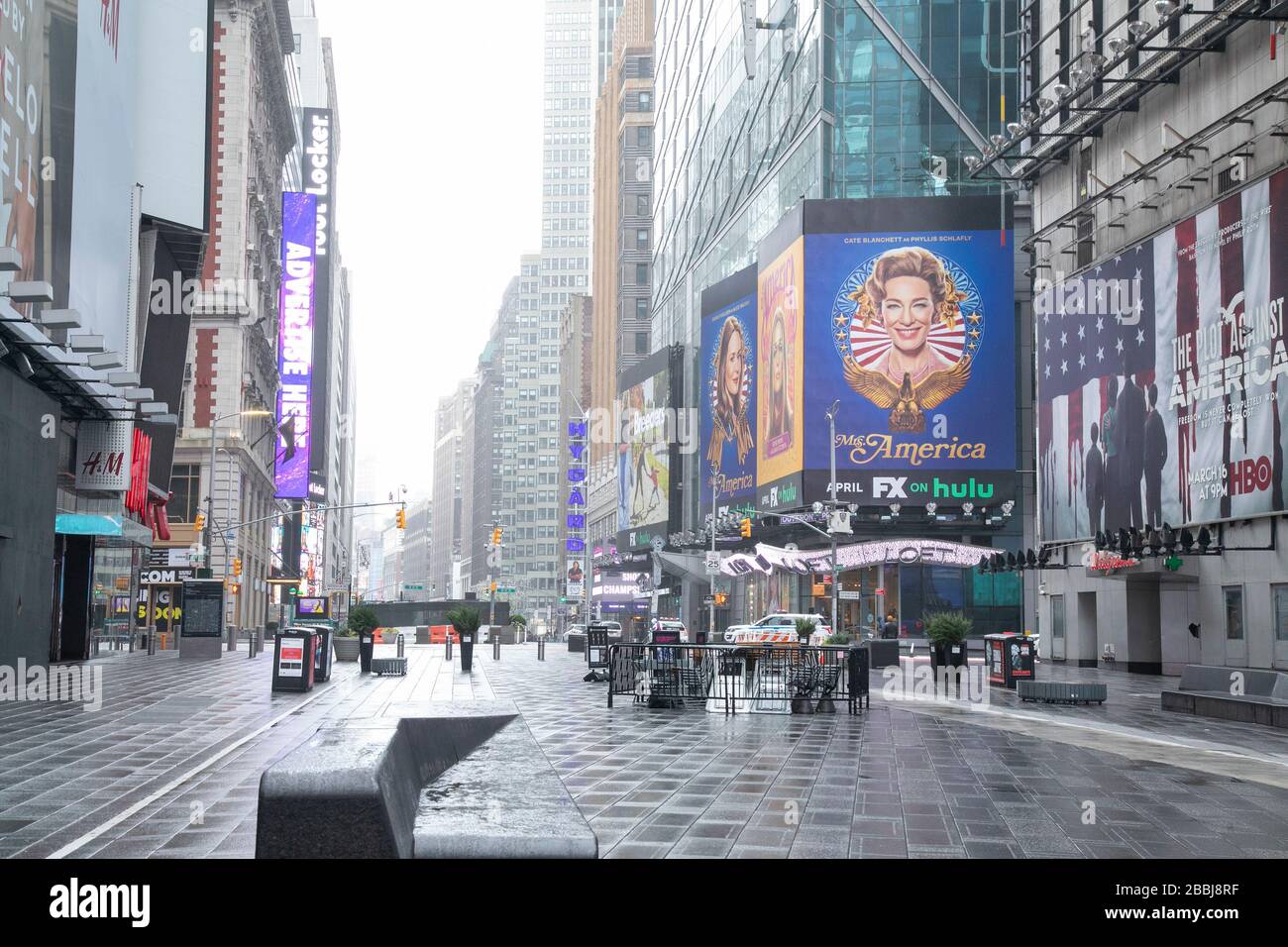 A quiet rainy day in Times Square during the coronavirus pandemic Stock ...