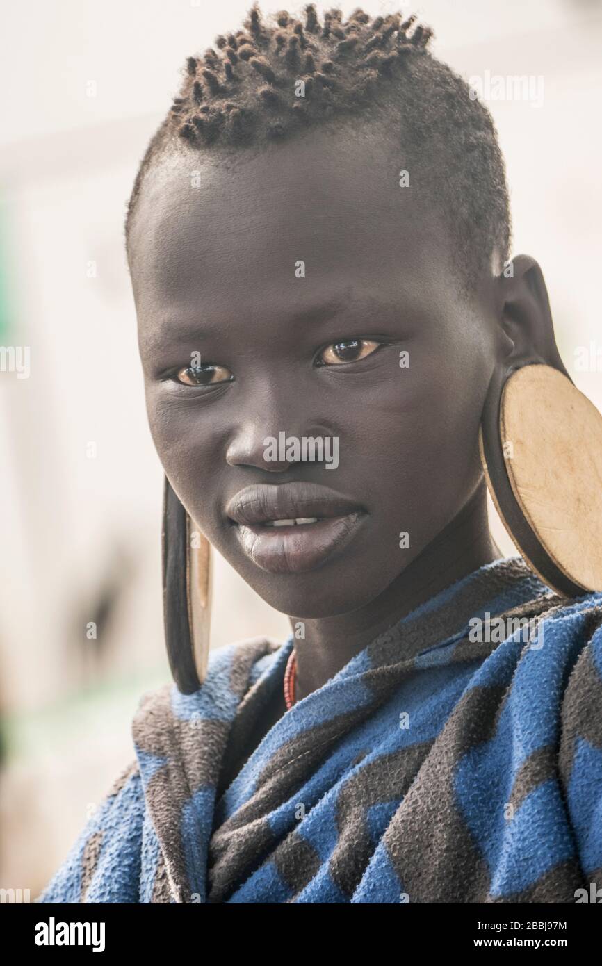 An Ethiopian Mursi Tribe Woman Head Shot with Traditional Plates in Her ...