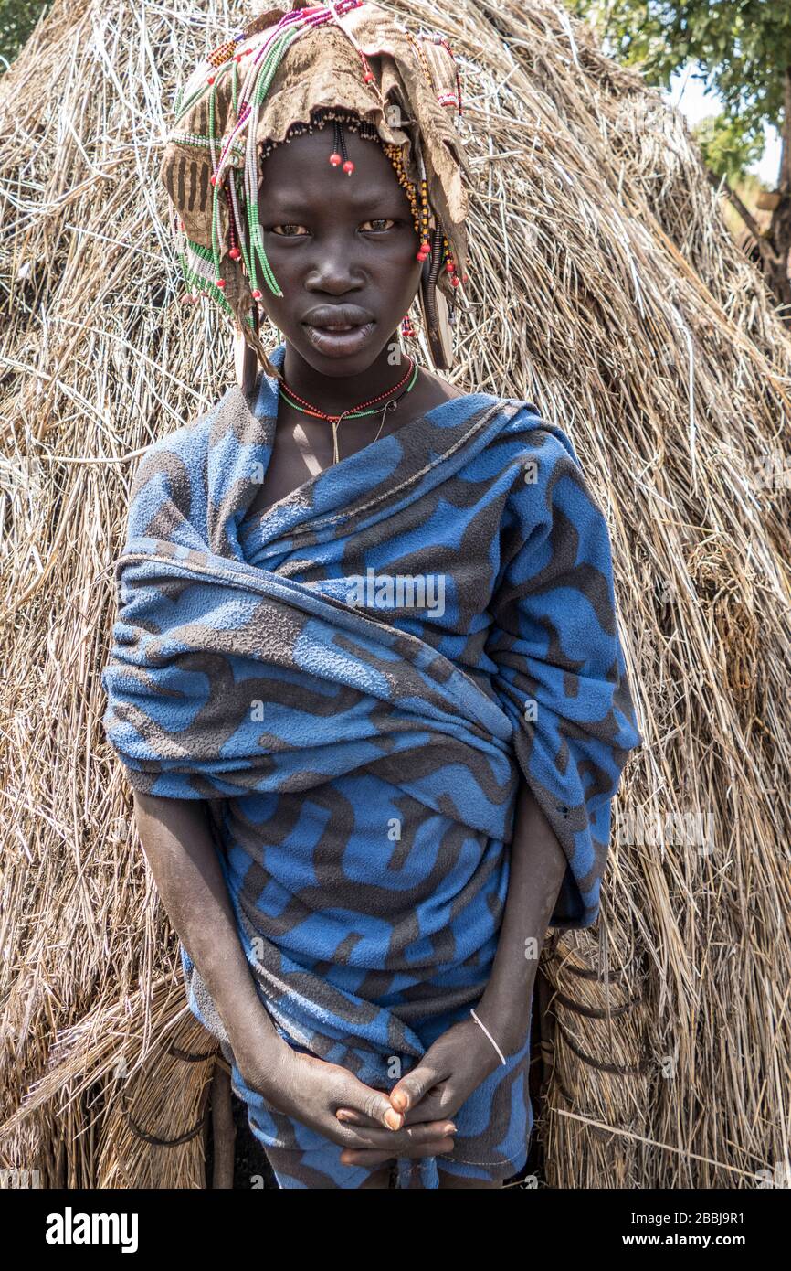 A Traditional Mursi Tribe Young Woman in Traditional Clothing in the ...