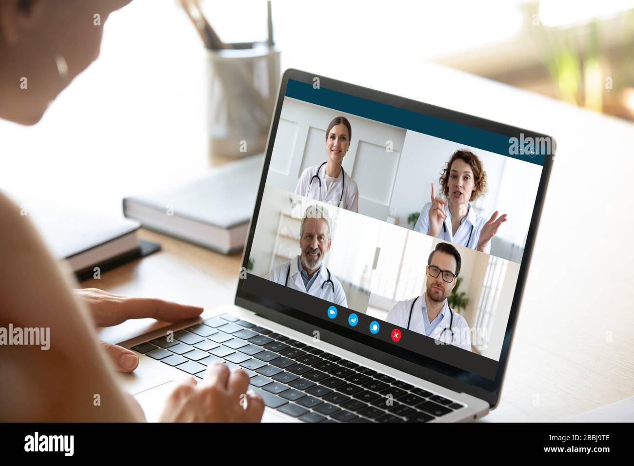 Close up of young female talk on video call consult with diverse ...