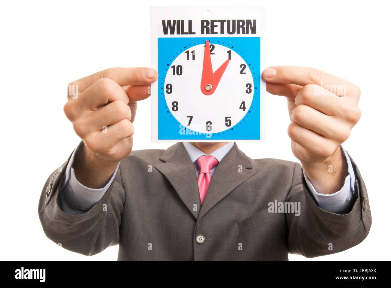 Businessman holding up a Will Return sign in front of his face against ...